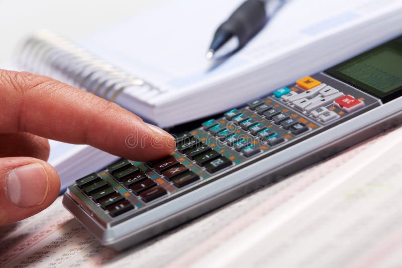Hand with calculator. stock image. Image of businessman - 89818939