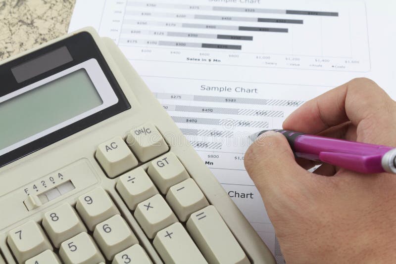 Hand on Calculator Paper and Pen Stock Image - Image of investment ...