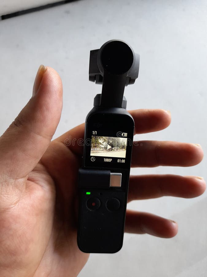 Hand camera in hand stock photo. Image of organ, electronics - 200591338