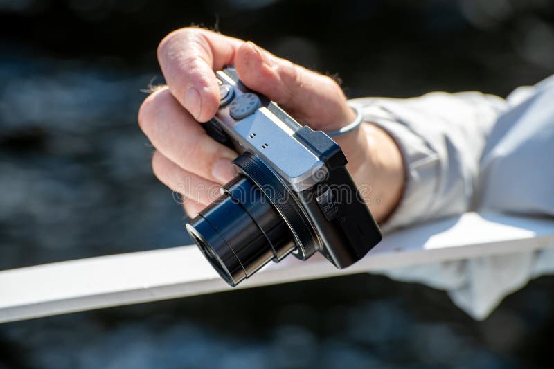 Hand with Camera and Looking at the Display Stock Photo - Image of ...