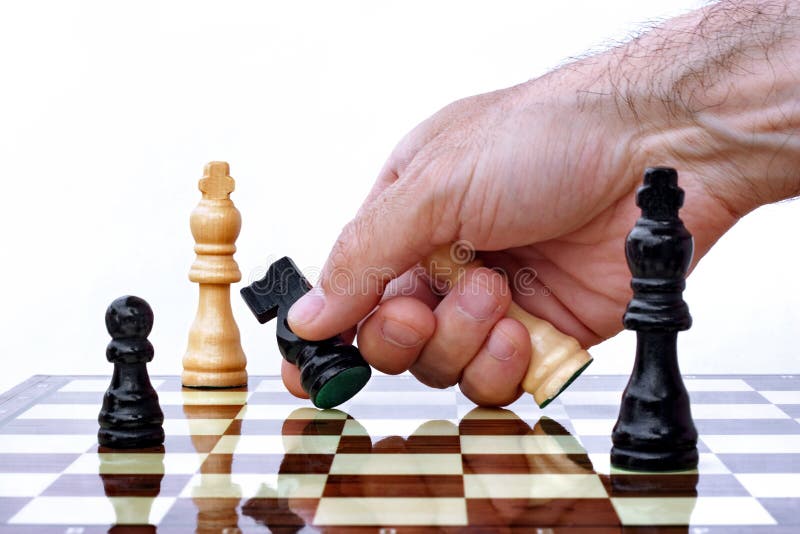 Hand capturing chess piece stock photo. Image of competitive - 9480462