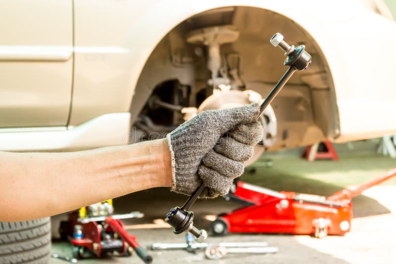 Hand with Car Stabilizer Control Link, Close Up. Stock Photo - Image of ...