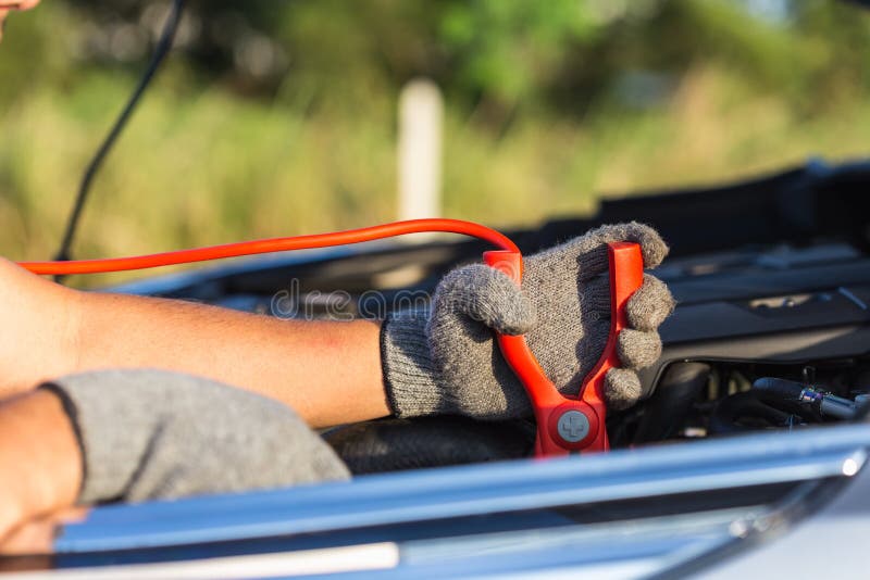 Hand of Car Technician Holding Cable To Connect To Battery Stock Image ...