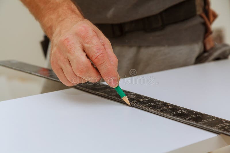 Hand of a Carpenter Measures the Distance Using a Builder& X27;s Square ...