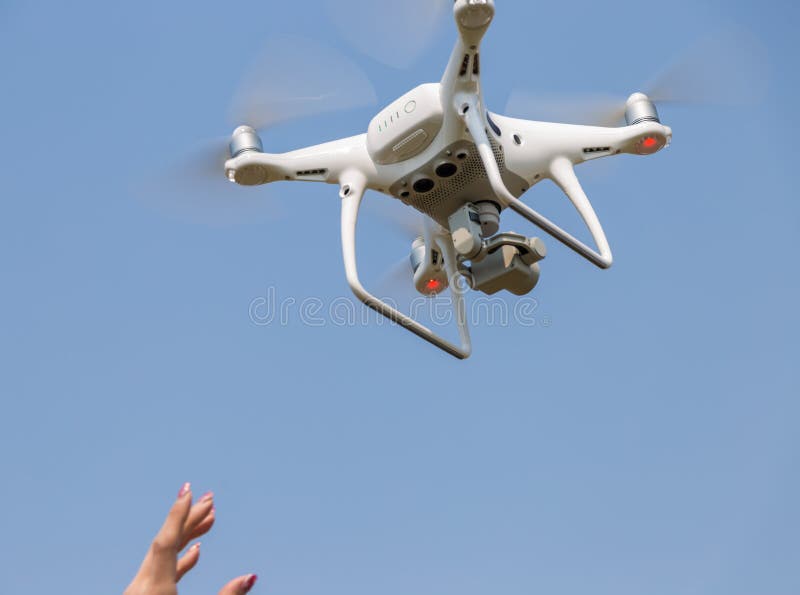 Hand catch drone stock photo. Image of brunette, motion - 88869444