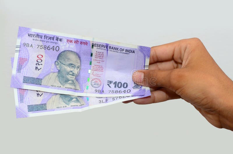 Hand Catch Indian New Currency 100 Rupees Note. Stock Image - Image of ...