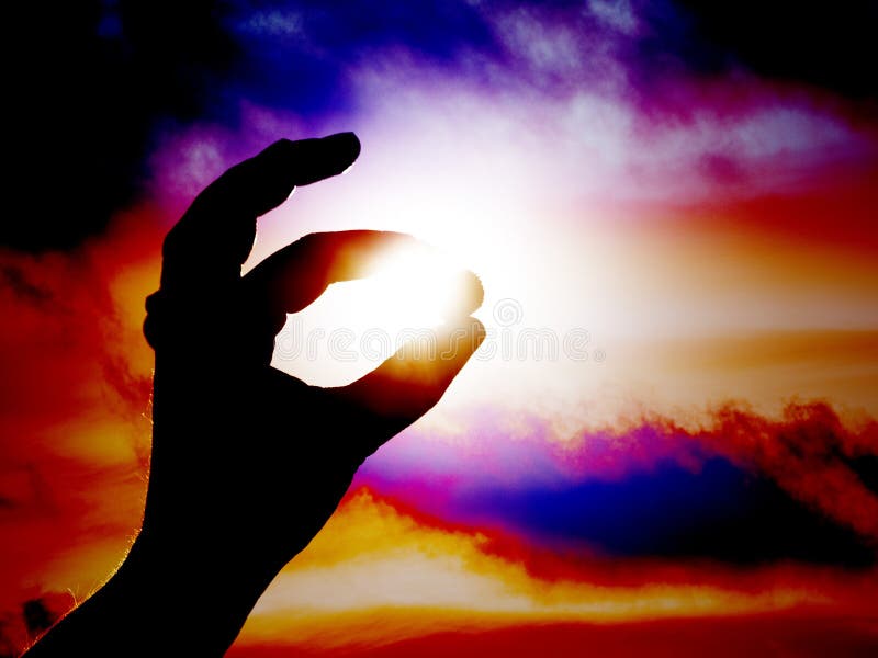 Hand catching the sun stock image. Image of concept - 214408399