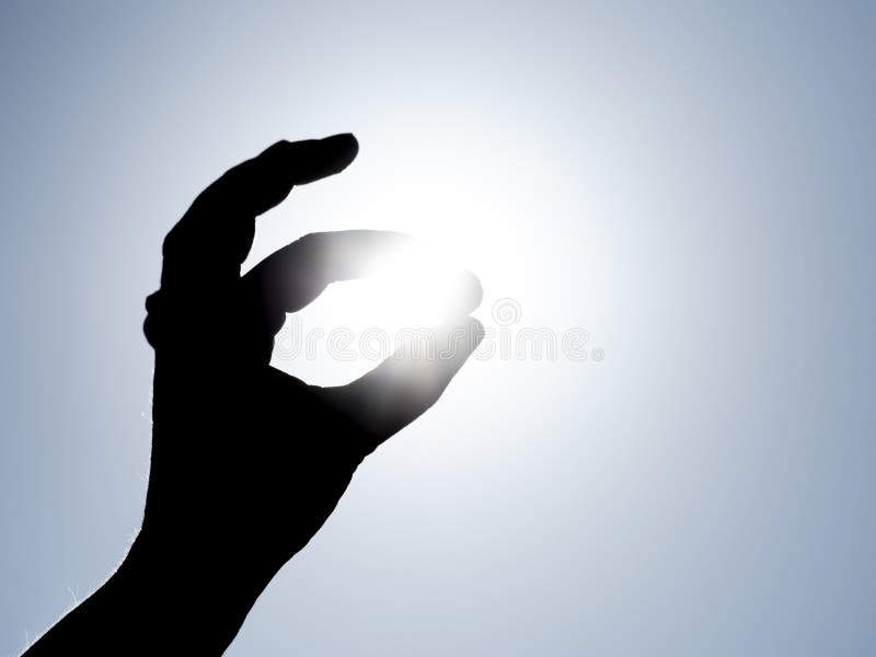 Hand catching the sun stock photo. Image of power, religion - 214408396