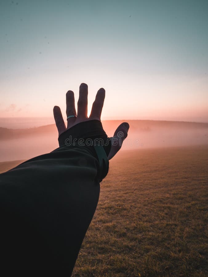 Hand Catching Sun at Sunrise in Fog in Autumn Stock Image - Image of ...