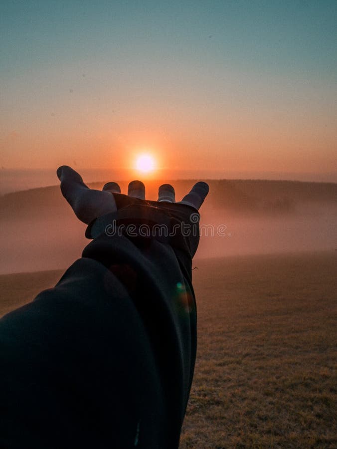 Hand Catching Sun at Sunrise in Fog in Autumn Stock Image - Image of ...