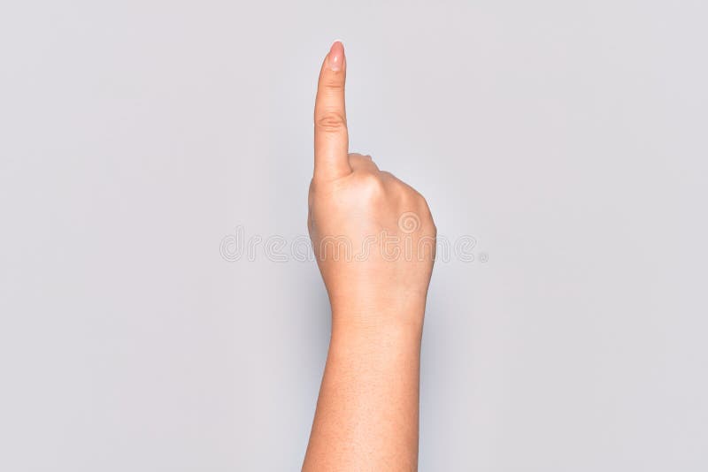 Hand of Caucasian Young Woman Counting Number One Using Index Finger ...