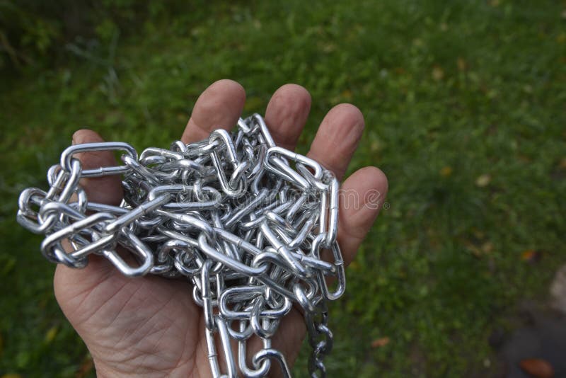 The Man`s Arm is Bound by an Iron Shiny Chain Stock Image - Image of ...