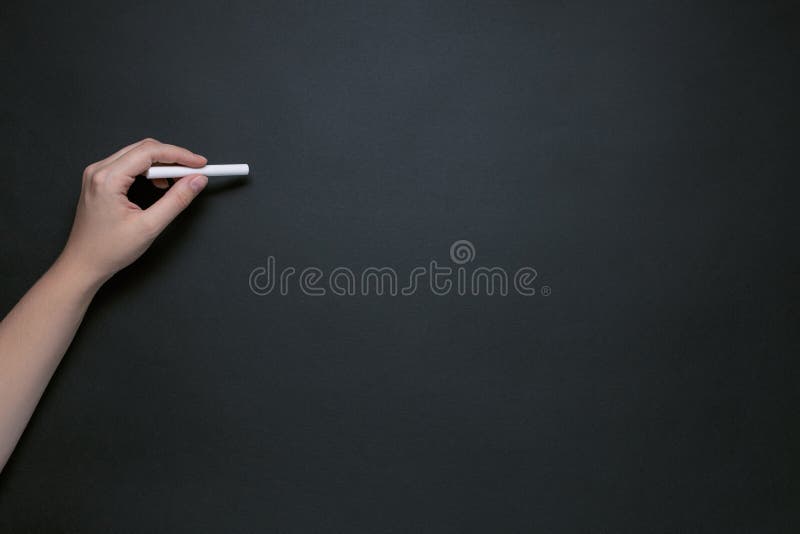 Hand with Chalk on Black Chalkboard, Place for Text, Basis for Design ...