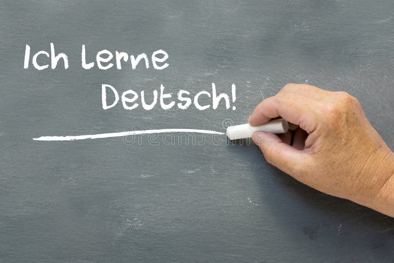 Hand on a Chalkboard with the German Words Ich Lerne Deutsch (I Stock ...
