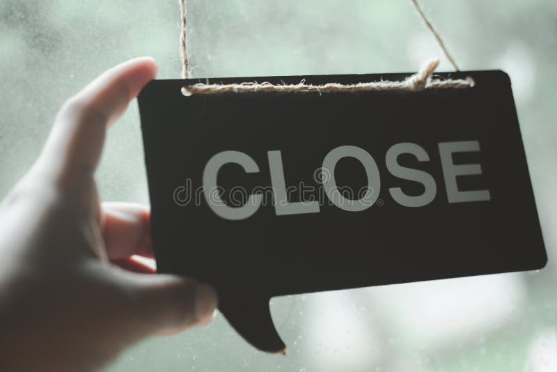 Hand Changing Closed Sign Board through the Glass of Door Stock Photo ...