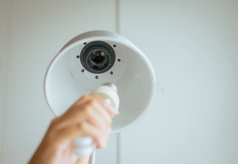 Hand Changing with New LED Lamp Light Bulb,Power Saving Concept ...