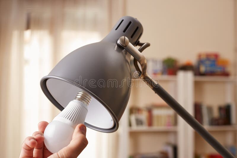 Hand Changing a Regular Light Bulb for LED Stock Image - Image of lamp ...