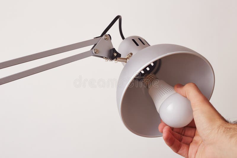 Hand Changing a Regular Light Bulb for LED Stock Image - Image of hand ...
