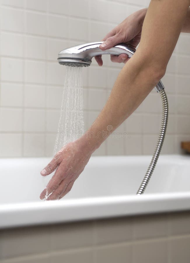 Hand Checking the Temperature of the Bath Water Stock Image - Image of ...