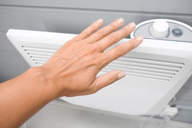 A Hand Checking Temperature of Heating Con on the Wall, Air Heating the ...
