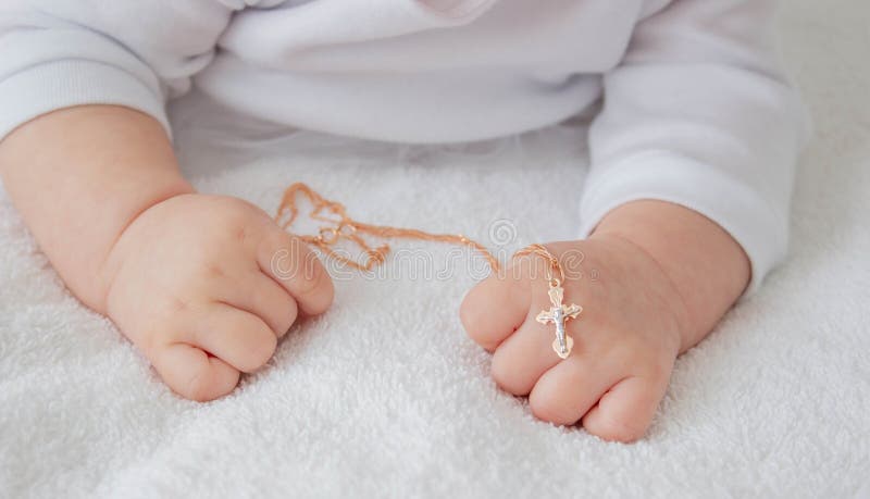 Hand of a Child with a Cross, Baptism of a Child Stock Photo - Image of ...