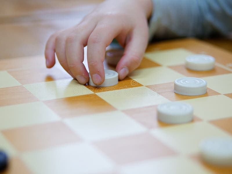 Hand Child Playing Checkers at the Table Stock Image - Image of black ...