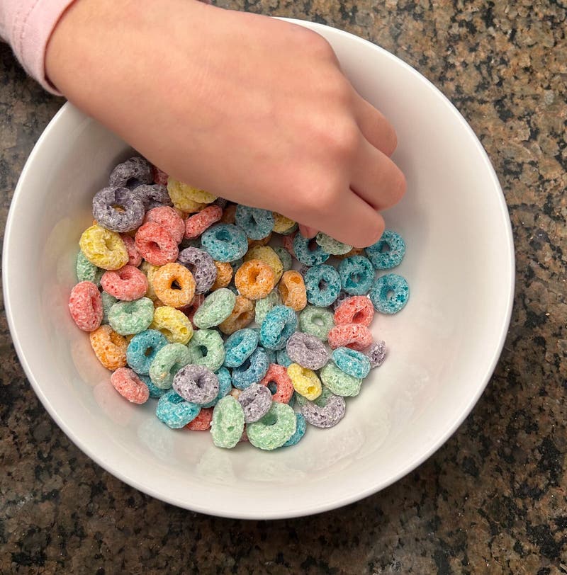 Hand of a Child Taking Cereal from a Bowl Stock Image - Image of bowl ...