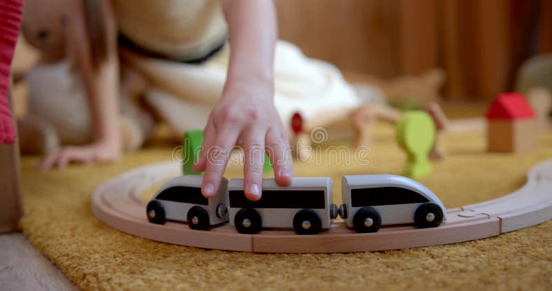 Hand of a Children Who is Playing with a Toy Train Stock Image - Image ...