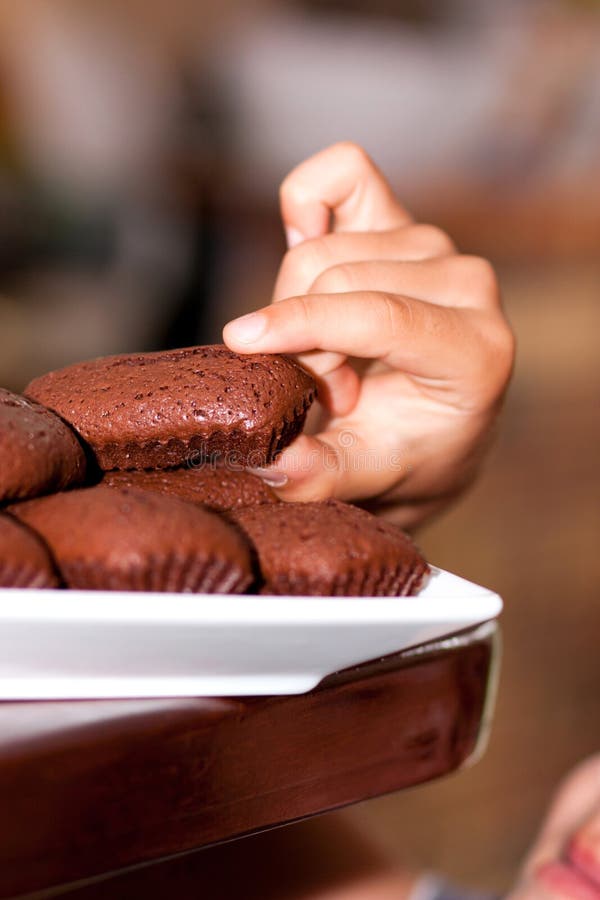 Hand and chocolat cake stock image. Image of food, baking - 20777113