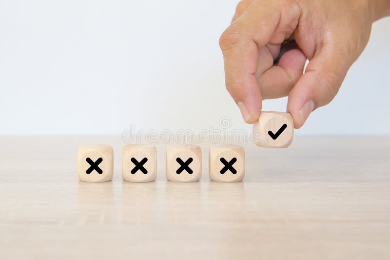 Hand Choose Check Mark with Cross Symbol on Cube Wooden Block Stack for ...