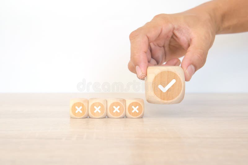 Hand Choose Check Mark with Cross Symbol on Cube Wooden Block Stack for ...