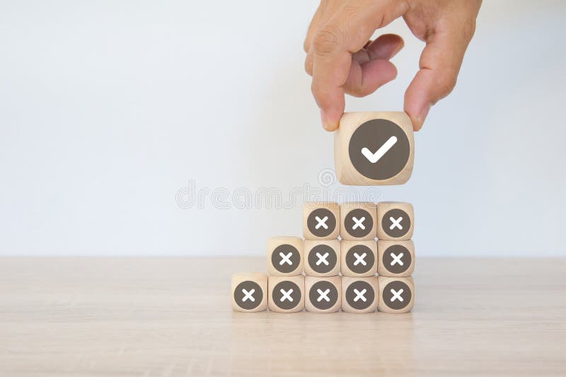 Hand Choose Check Mark with Cross Symbol on Cube Wooden Block Stack for ...