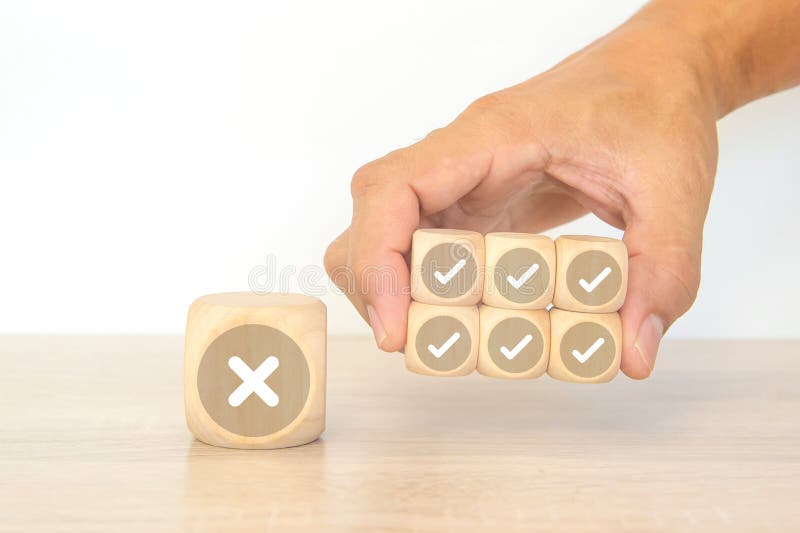 Hand Choose Check Mark with Cross Symbol on Cube Wooden Block Stack for ...