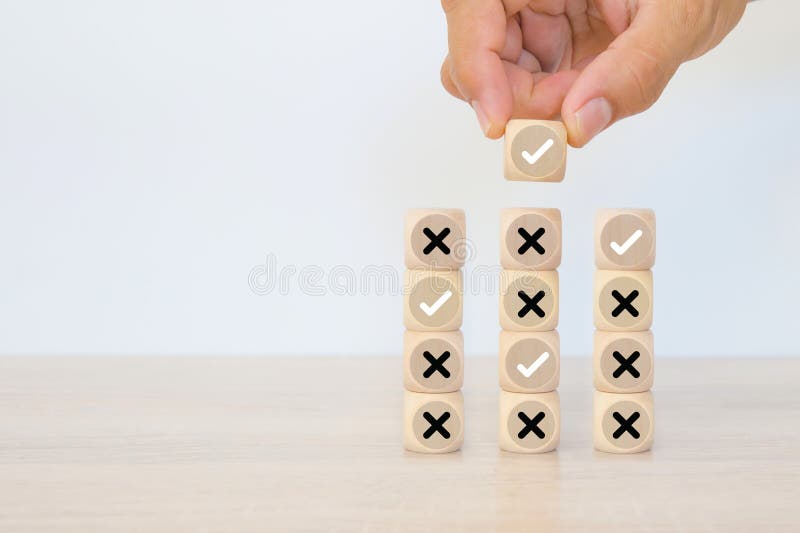 Hand Choose Check Mark with Cross Symbol on Cube Wooden Block Stack for ...
