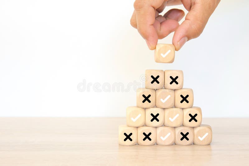 Hand Choose Check Mark with Cross Symbol on Cube Wooden Block Stack for ...