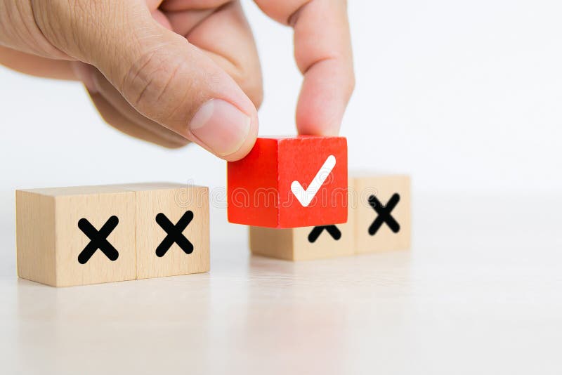 Hand Choose Check Mark on Cube Wooden Toy Block Stack with Cross Symbol ...