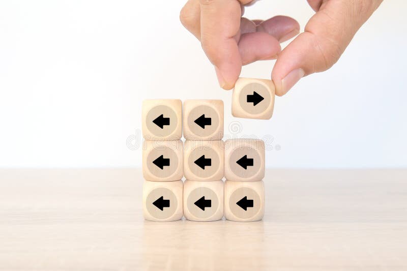 Hand Chooses Arrow Icon Point To the Opposite Side on Cube Wooden Block ...