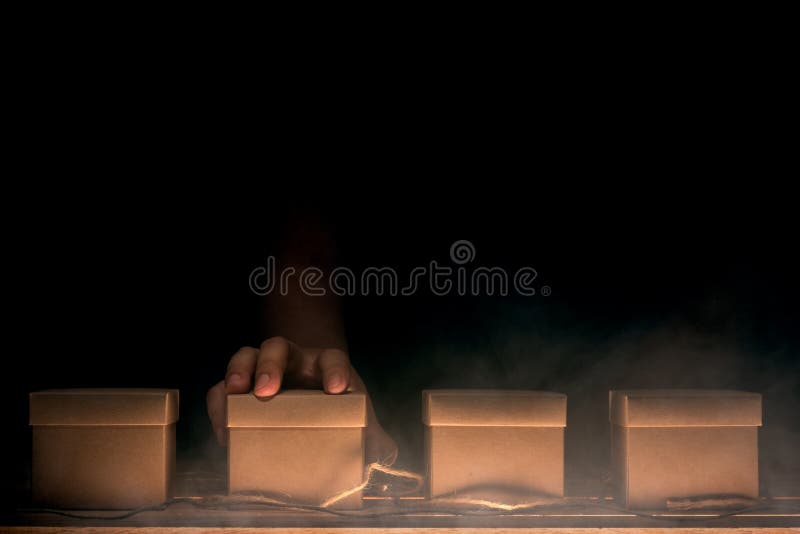 Hand choosing a box stock photo. Image of enigma, gift - 126961390