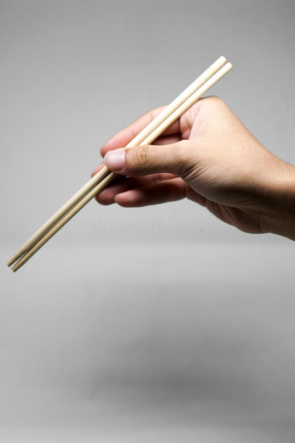 Hand Chopstick Sticking Together Stock Photo - Image of closeup ...