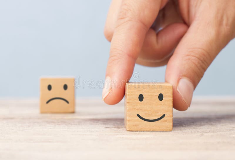 Hand Chose Smiley Face Front of Sad Face.customer Satisfaction Concept ...