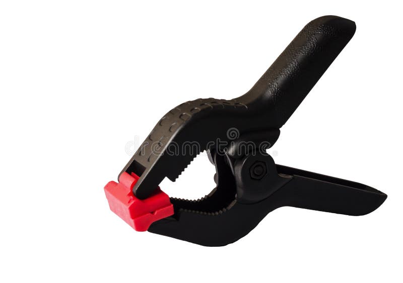Plastic Clamps Squeezing Finger on a White Background Stock Photo ...