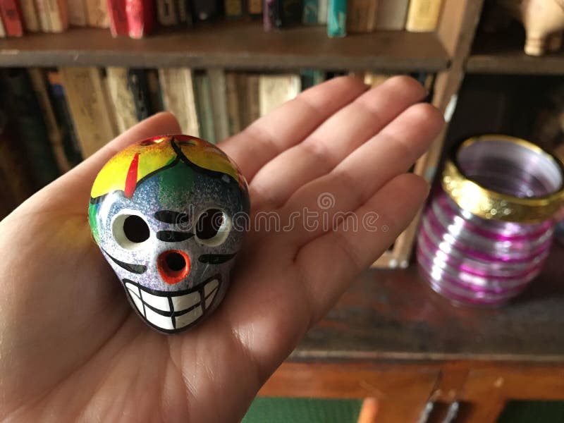 Hand with a clay skull stock image. Image of ceramic - 167717717