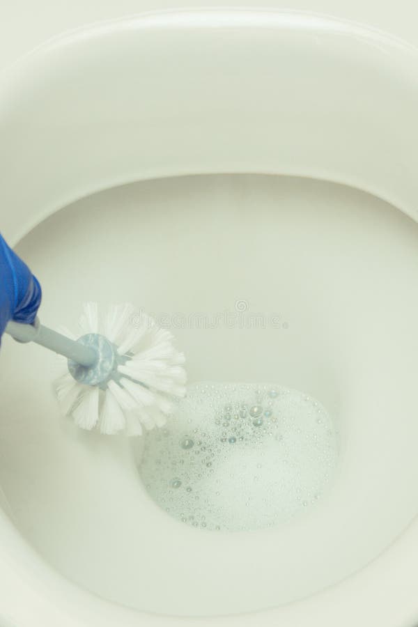 Hand of Cleaner Using Brush for Cleaning Toilet. Household Duties ... Hand of Cleaner Using Brush for Cleaning Toilet. Household Duties ...