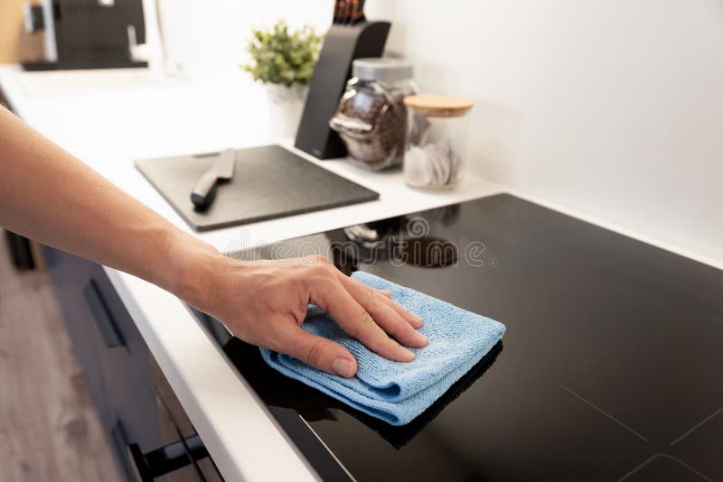 Hand Cleaning Induction Stove Stock Photo - Image of polish, house ...
