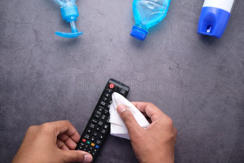 Man Hand Cleaning TV Remote Controller with Disinfectant Wet Wipe Stock ...