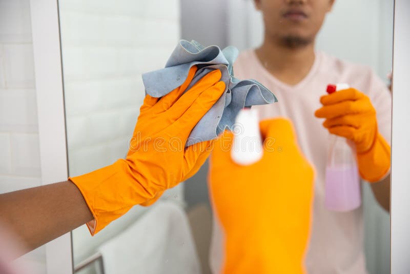 Cleaning Up the Mirror Using Cloth Stock Image - Image of window ...
