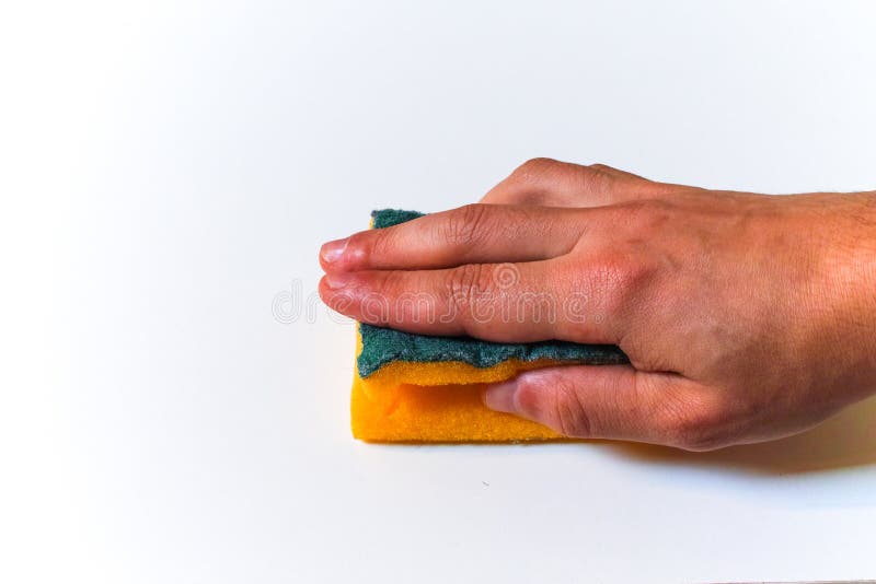 Hand Cleaning a White Surface with a Sponge. Stock Image - Image of ...