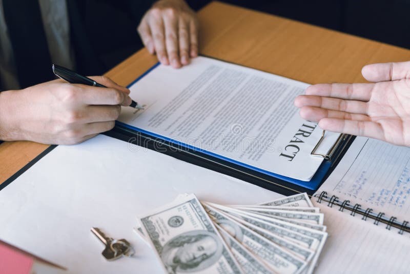 Hand Client Signing Contract Paper a Real Estate or Mortgage Contract ... Hand Client Signing Contract Paper a Real Estate or Mortgage Contract ...