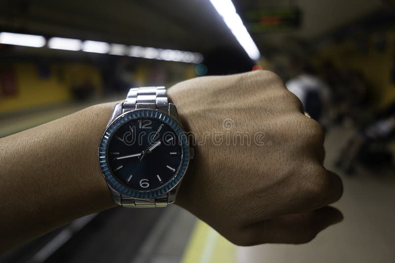 Hand with Clock Waiting for the Subway To Arrive Stock Photo - Image of ...