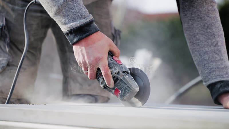 Hand Close-up of a Man Using Angle Grinder at a Construction Site Stock ...
